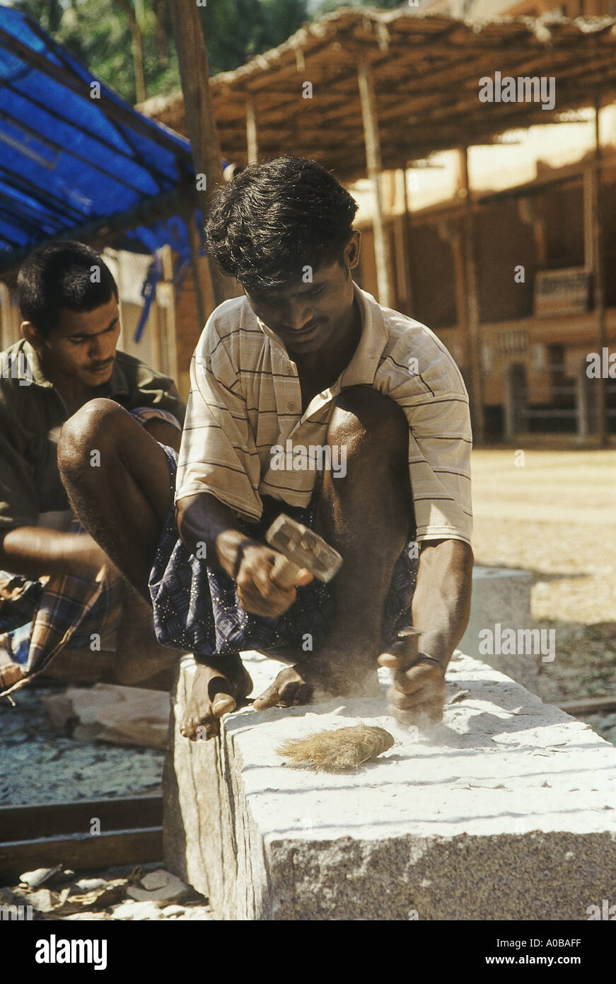A man carving stone to be used for decorating the Malasa Narayani ...