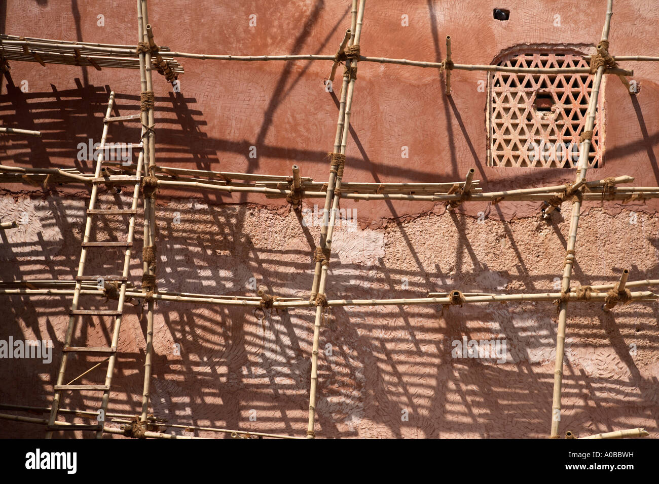 Bamboo scaffolding leaning against a wall for plastering work in Jaipur ...