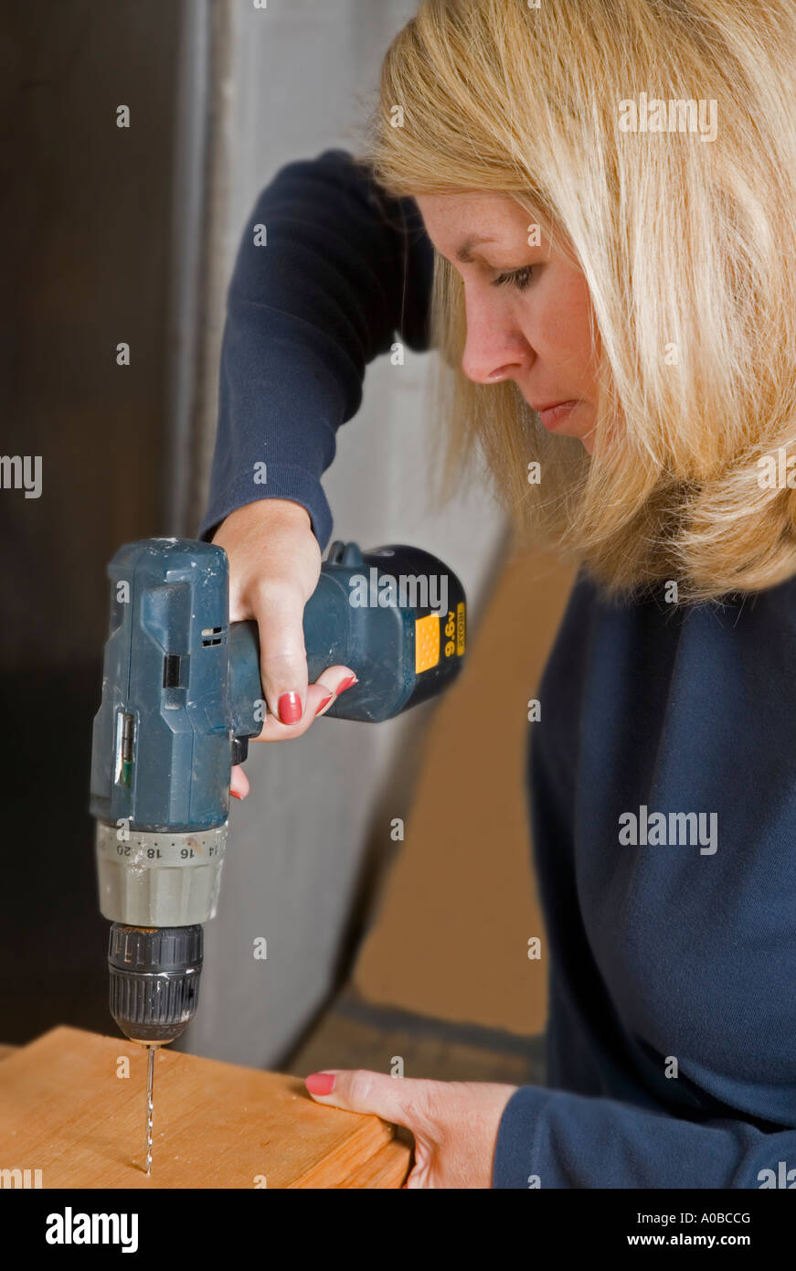 Woman drill tool hi-res stock photography and images - Alamy