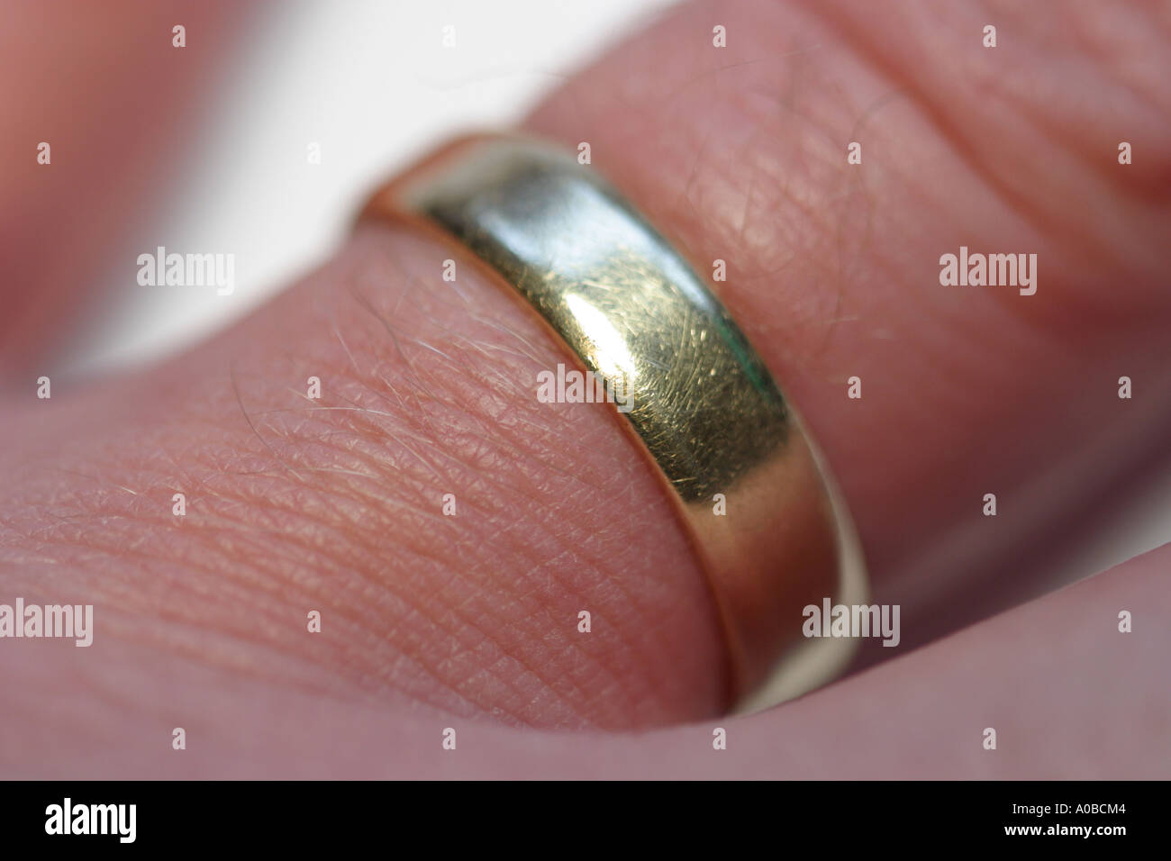 Wedding ring on a mans hand Stock Photo - Alamy