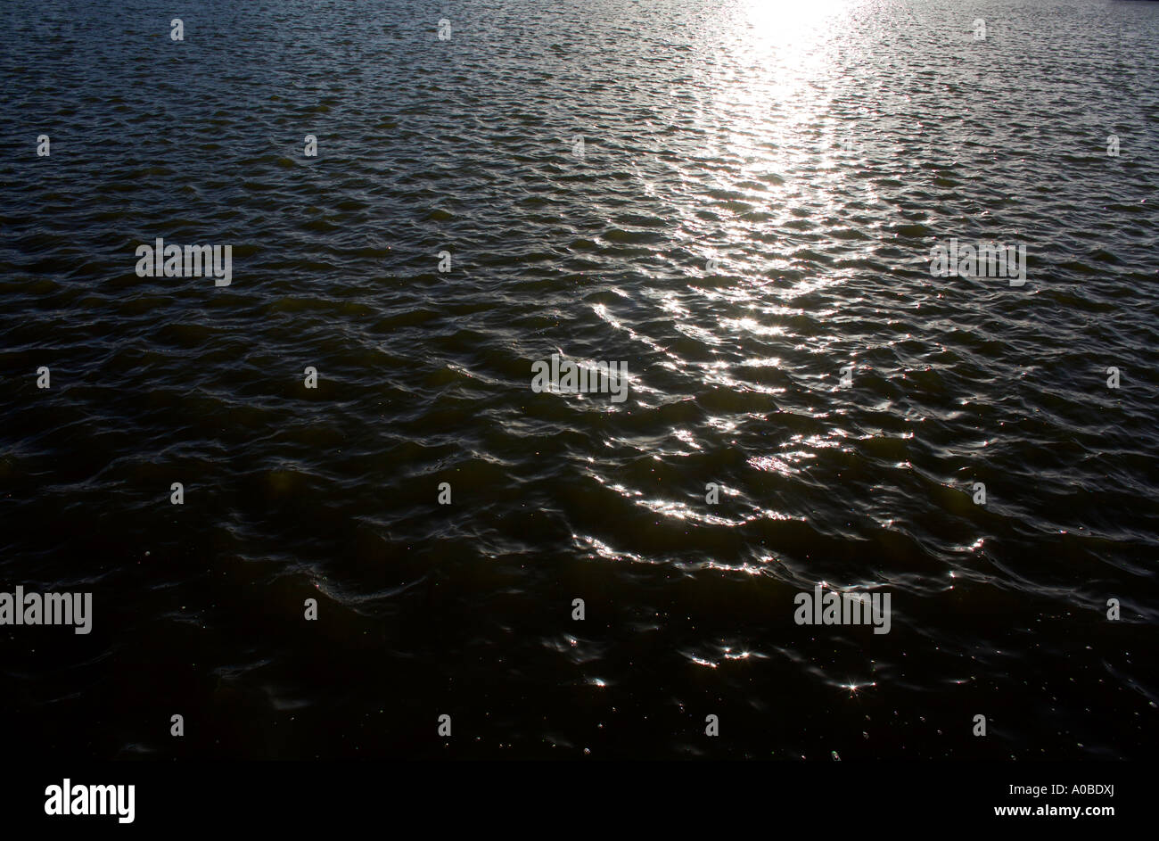 Sun reflected on water Stock Photo - Alamy