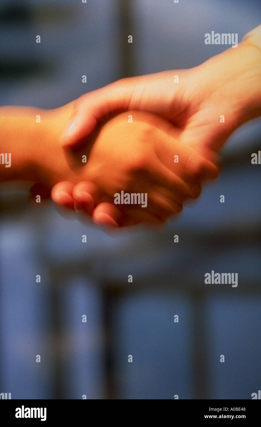 Handshake in motion Stock Photo - Alamy