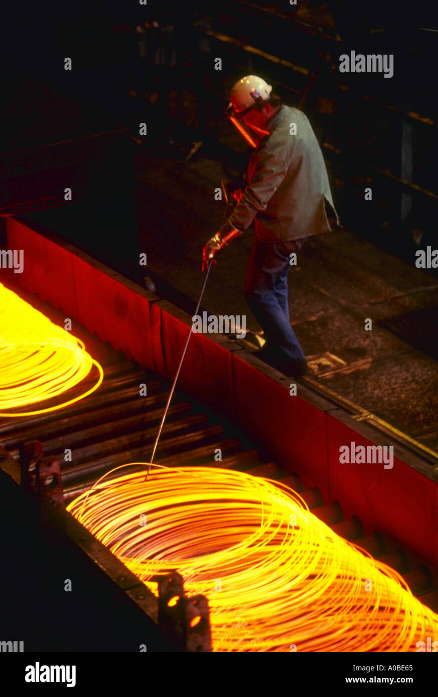 Steel rod being coiled for use as wire at Northwestern Steel in ...