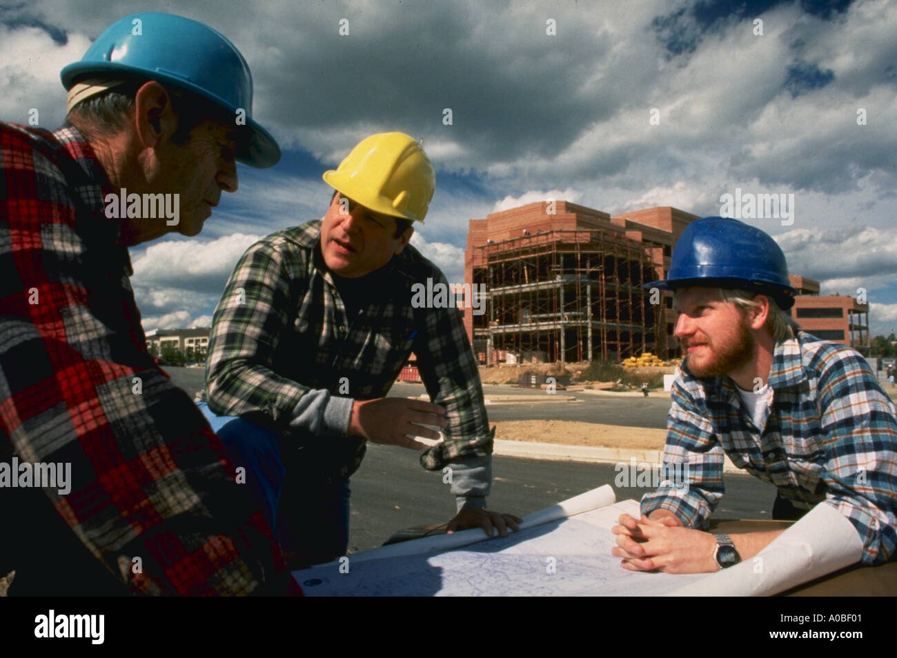 Construction workers at new office building site Stock Photo - Alamy