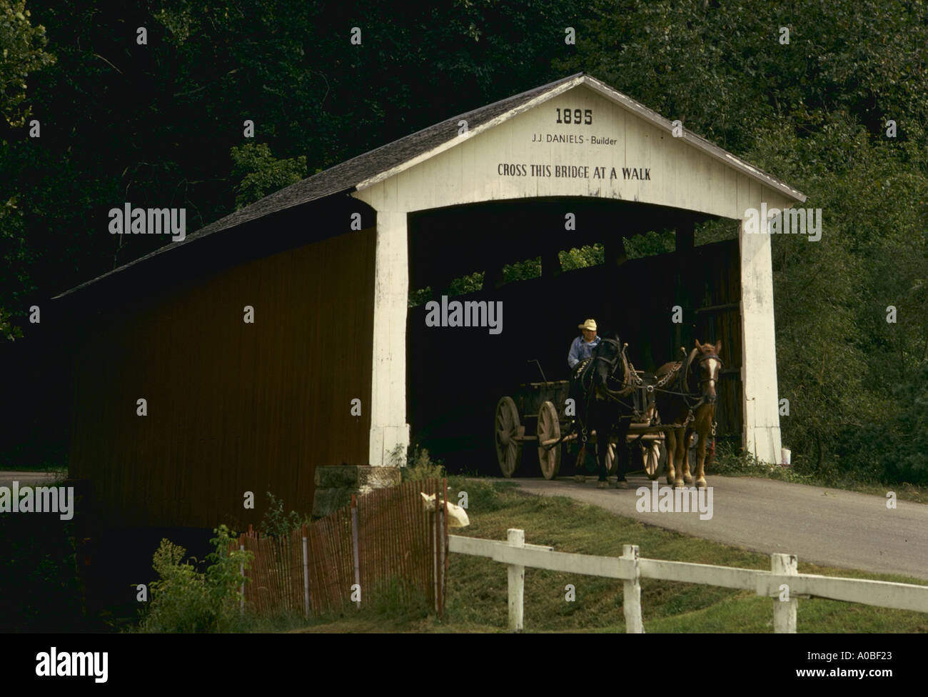 Horse and wagon coming through covered bridge in Illinois Stock Photo ...