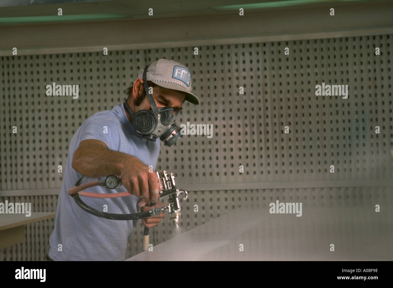 Male worker sprays paint hi-res stock photography and images - Alamy