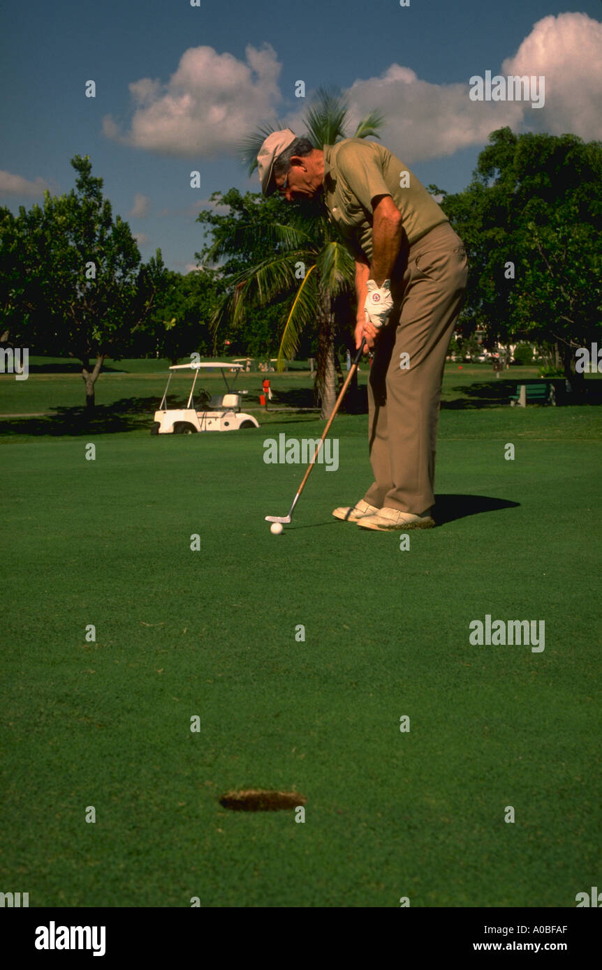 Retired man plays golf at Bayshore Golf Course Miami Beach Florida ...