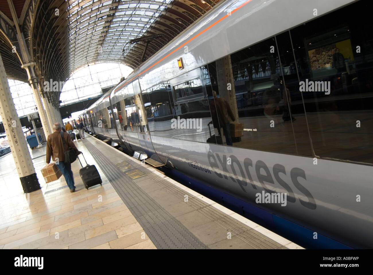 Heathrow Express train on the platform at Paddington Station, London UK ...