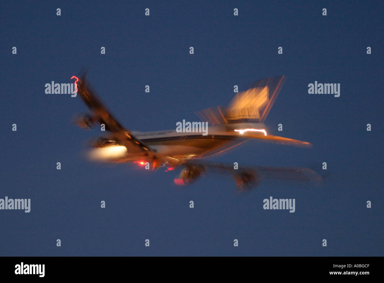 Commercial airplane at night Stock Photo - Alamy
