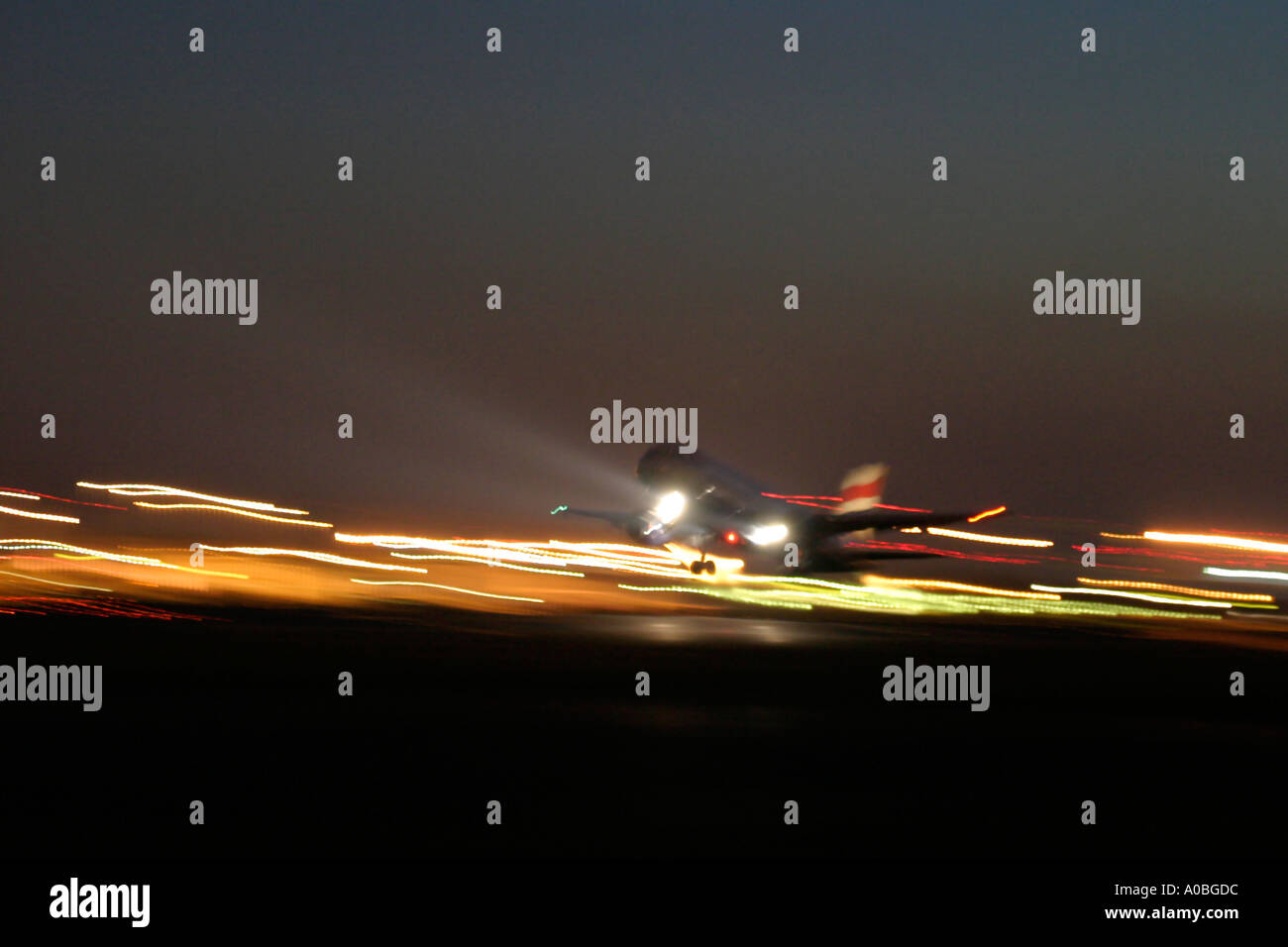 Airliner taking off at night London Heathrow Airport England UK Stock ...