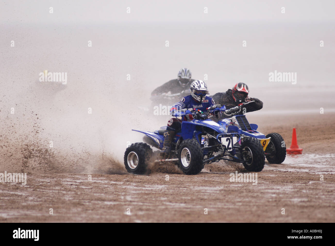 Sand racing on quad bikes on a beach in England Stock Photo - Alamy