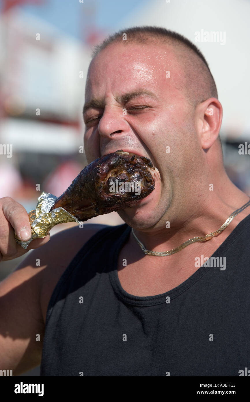 Portrait Caucasian man eating turkey leg Stock Photo - Alamy Portrait Caucasian man eating turkey leg Stock Photo - Alamy