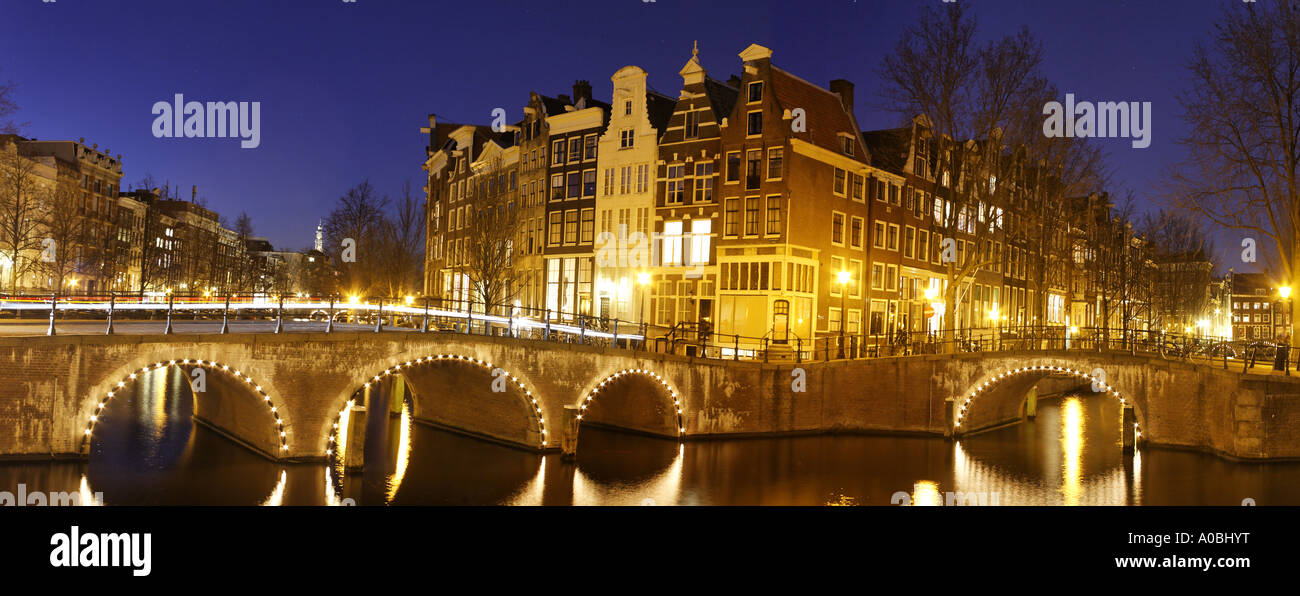 Illuminated canal bridges at night Amsterdam Netherlands Stock Photo ...