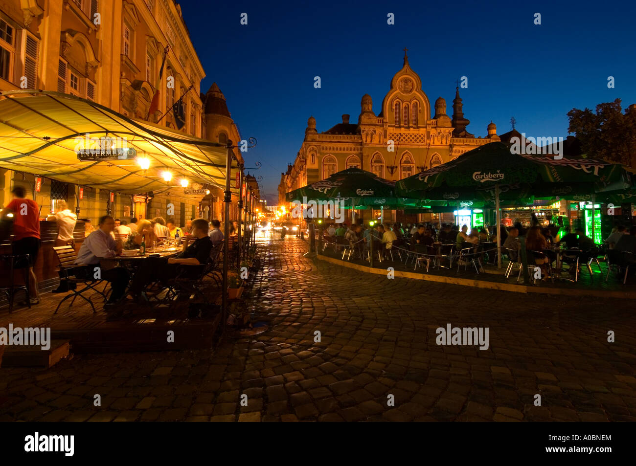 People enjoy drink in restaurants and bars on Piata Unirii at night ...