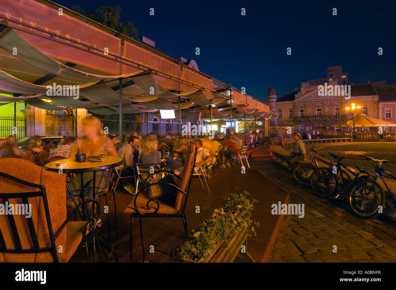 People enjoy drink in restaurants and bars on Piata Unirii at night ...