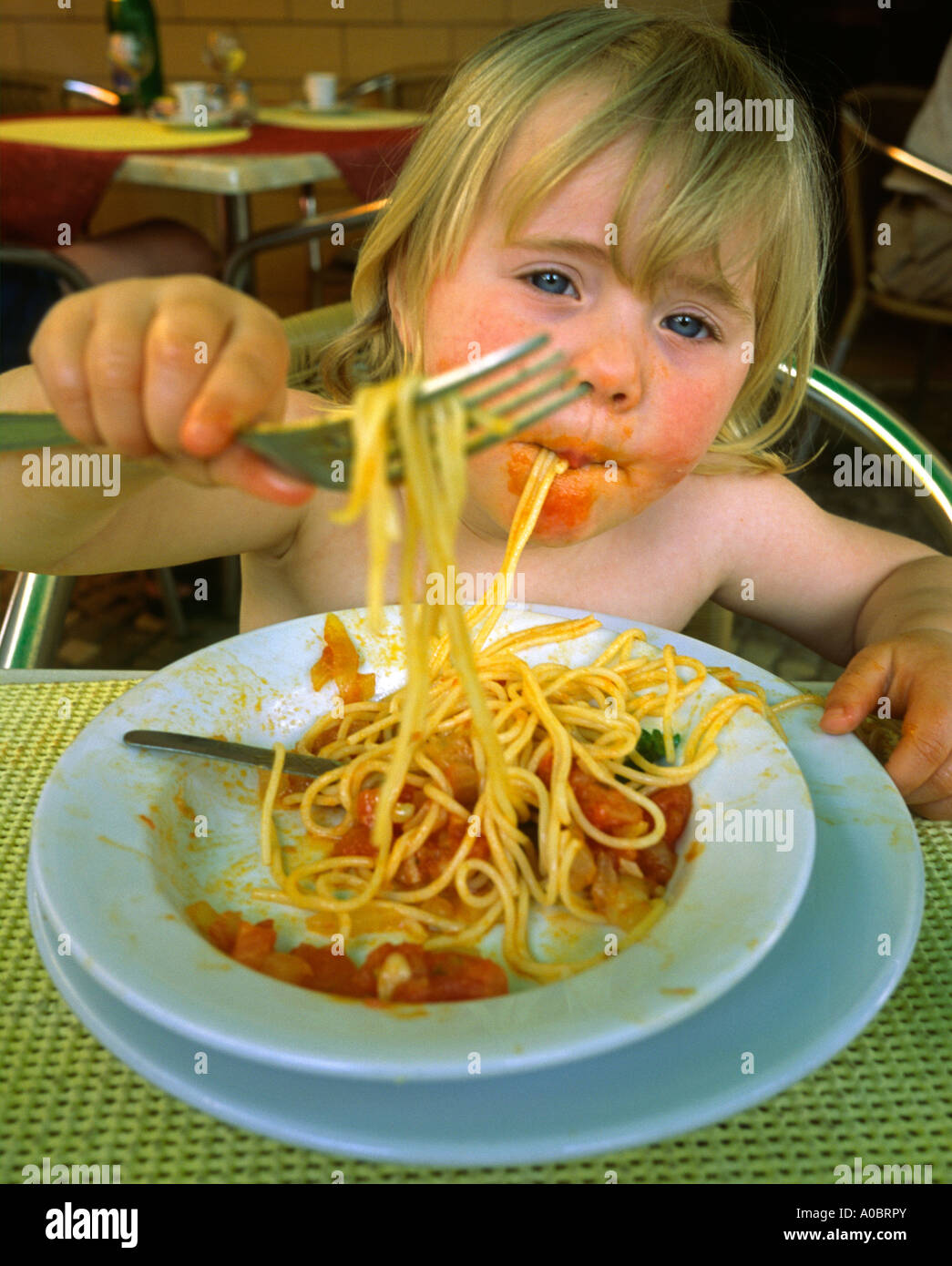 Child eating spaghetti bolognese hi-res stock photography and images ...