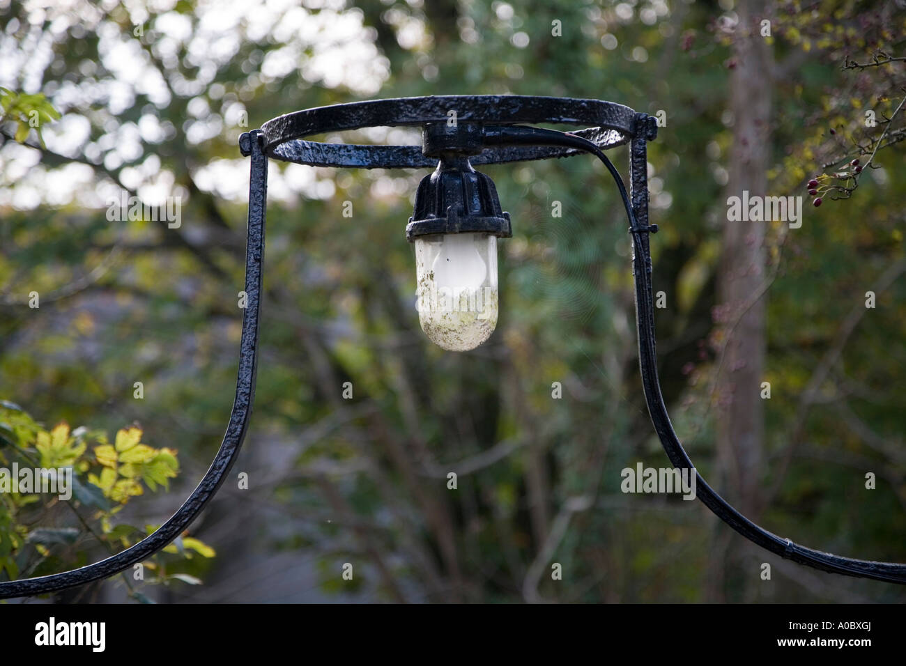 Old light fitting in country churchyard in Lanlivery Cornwall Stock ...