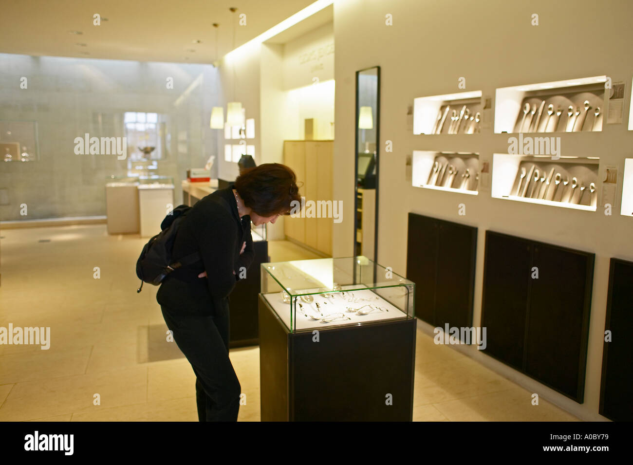Woman shopping at "Georg Jensen Design" shop, Copenhagen, Denmark ...