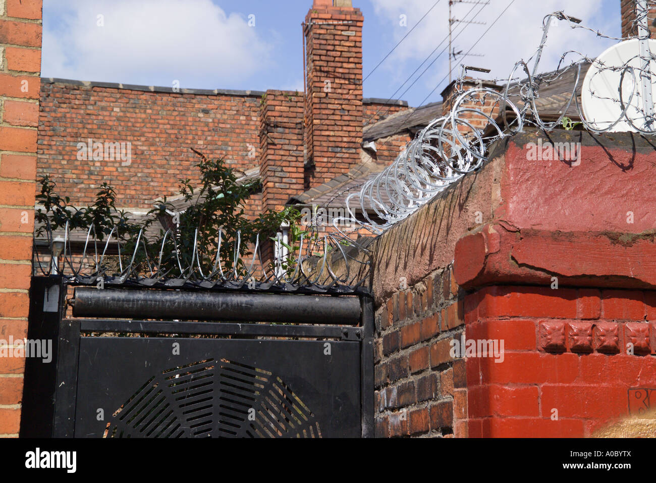 Barbed Wire on top of brick walls Anfield Liverpool Merseyside England ...