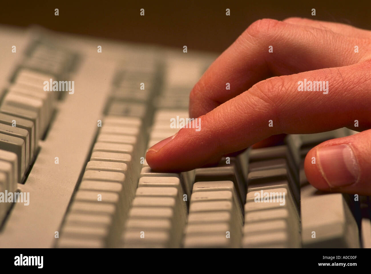 Hand on computer keyboard Stock Photo - Alamy