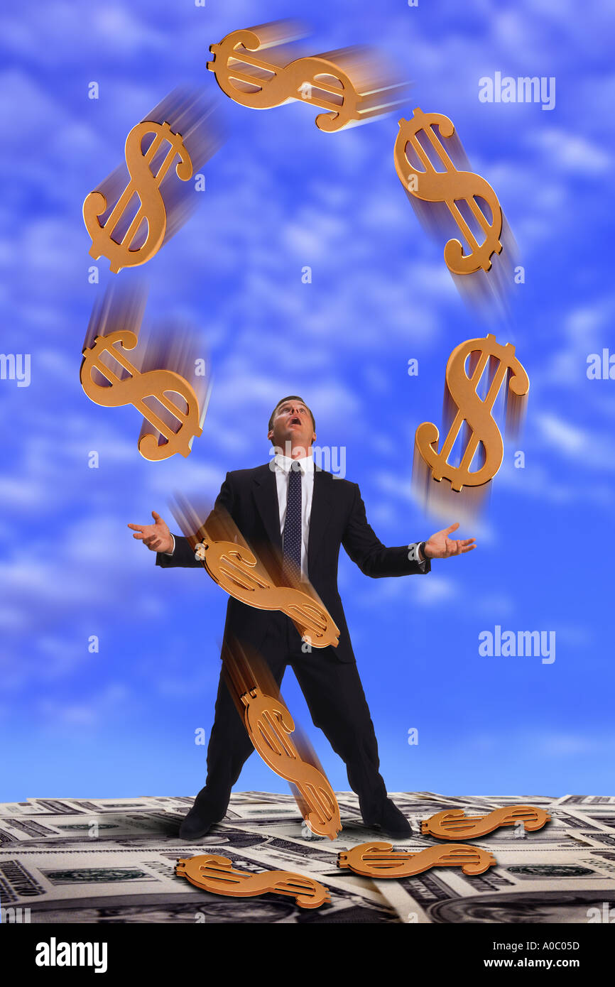 Businessman juggling money Stock Photo - Alamy