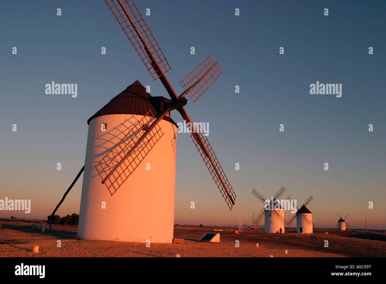 Windmills in the spanish Mota del Cuervo at dusk, Castilla-La Mancha ...