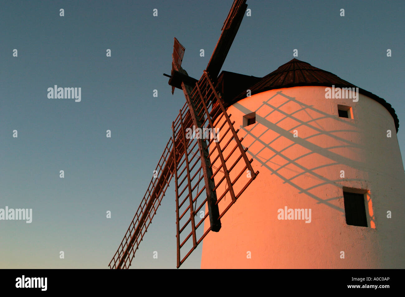 Windmills in the spanish Mota del Cuervo at dusk, Castilla-La Mancha ...