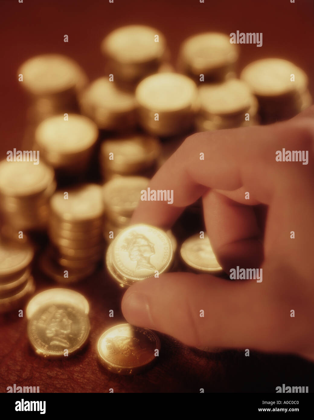 hand and coins Stock Photo - Alamy