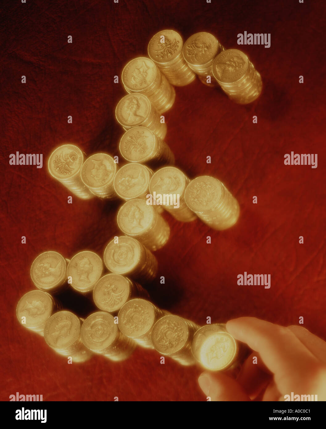 hand and one pound coins Stock Photo - Alamy