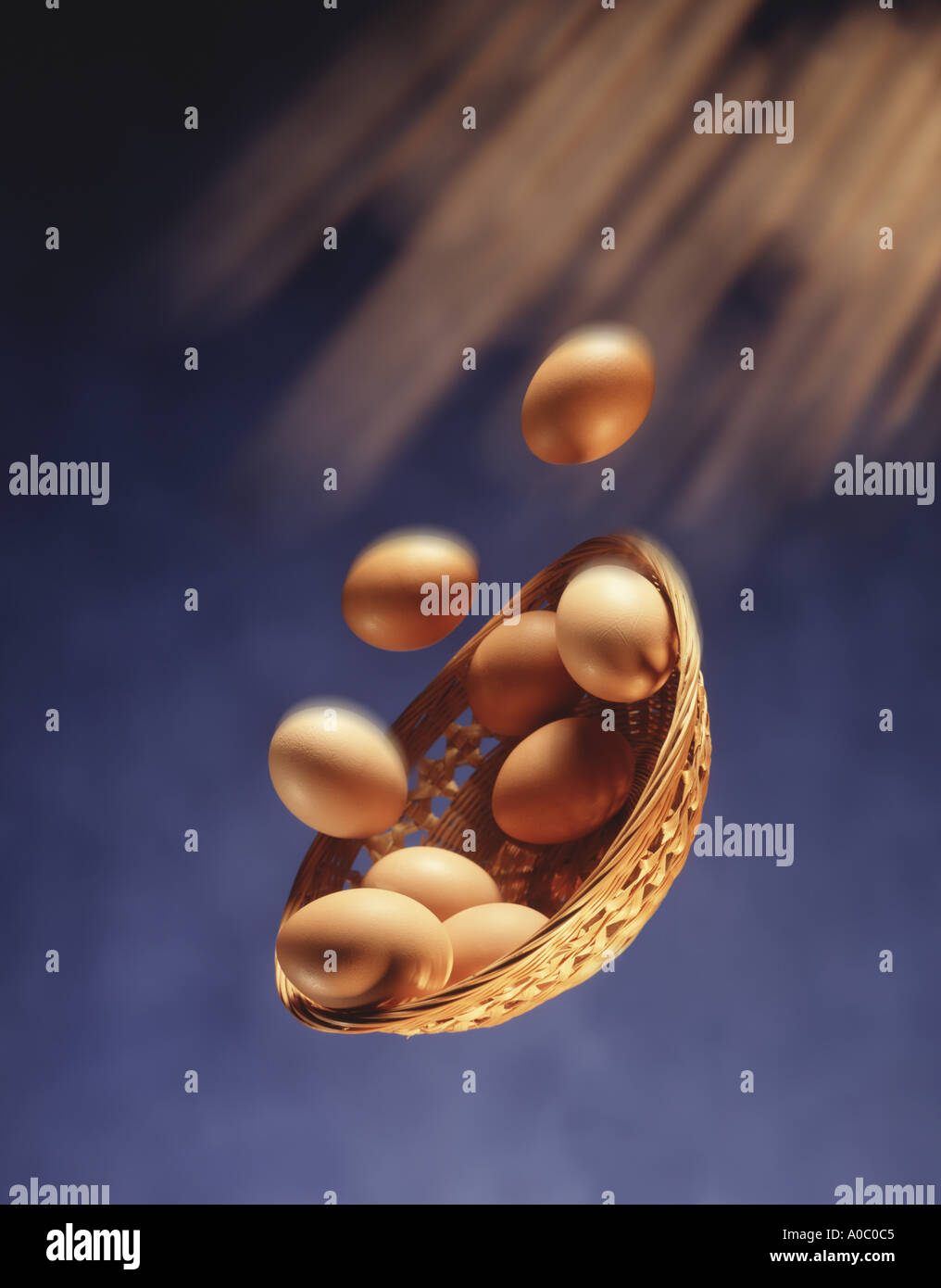 eggs falling in a basket Stock Photo - Alamy