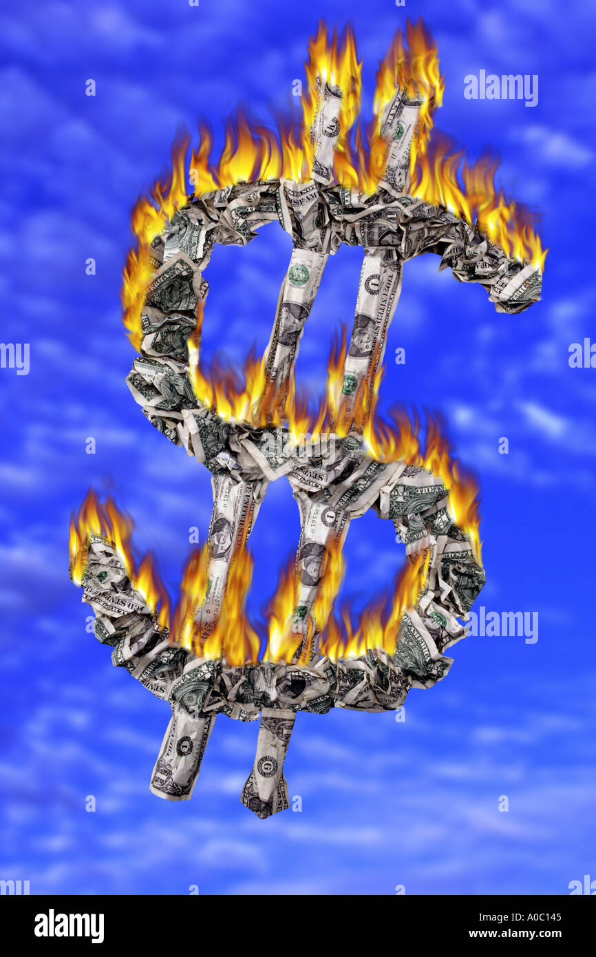 Burning money floating in sky Stock Photo - Alamy
