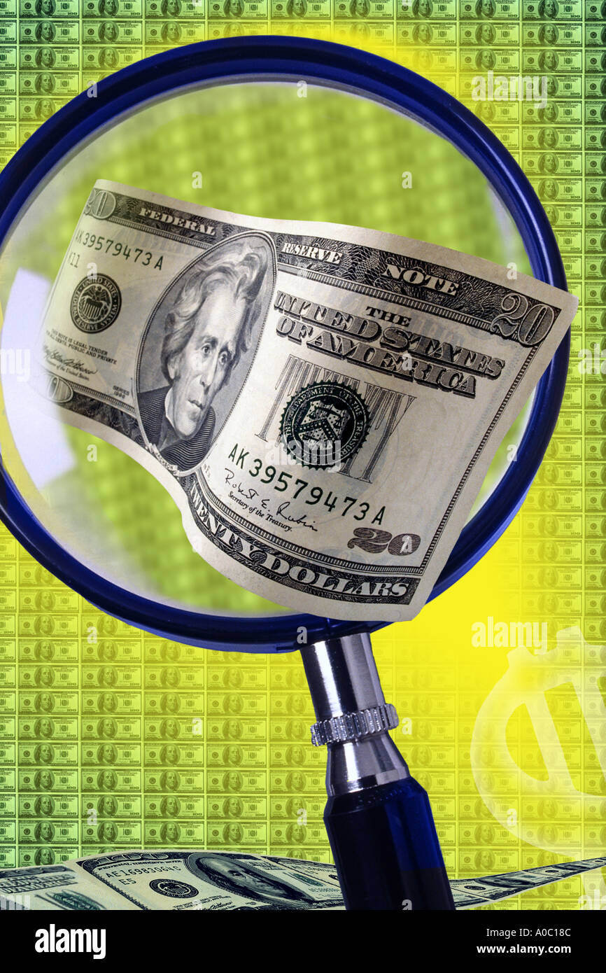 Money under magnifying glass Stock Photo - Alamy