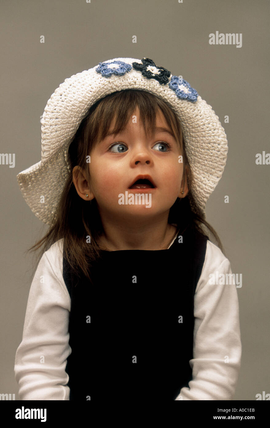 sweet cute girl wondering Stock Photo - Alamy