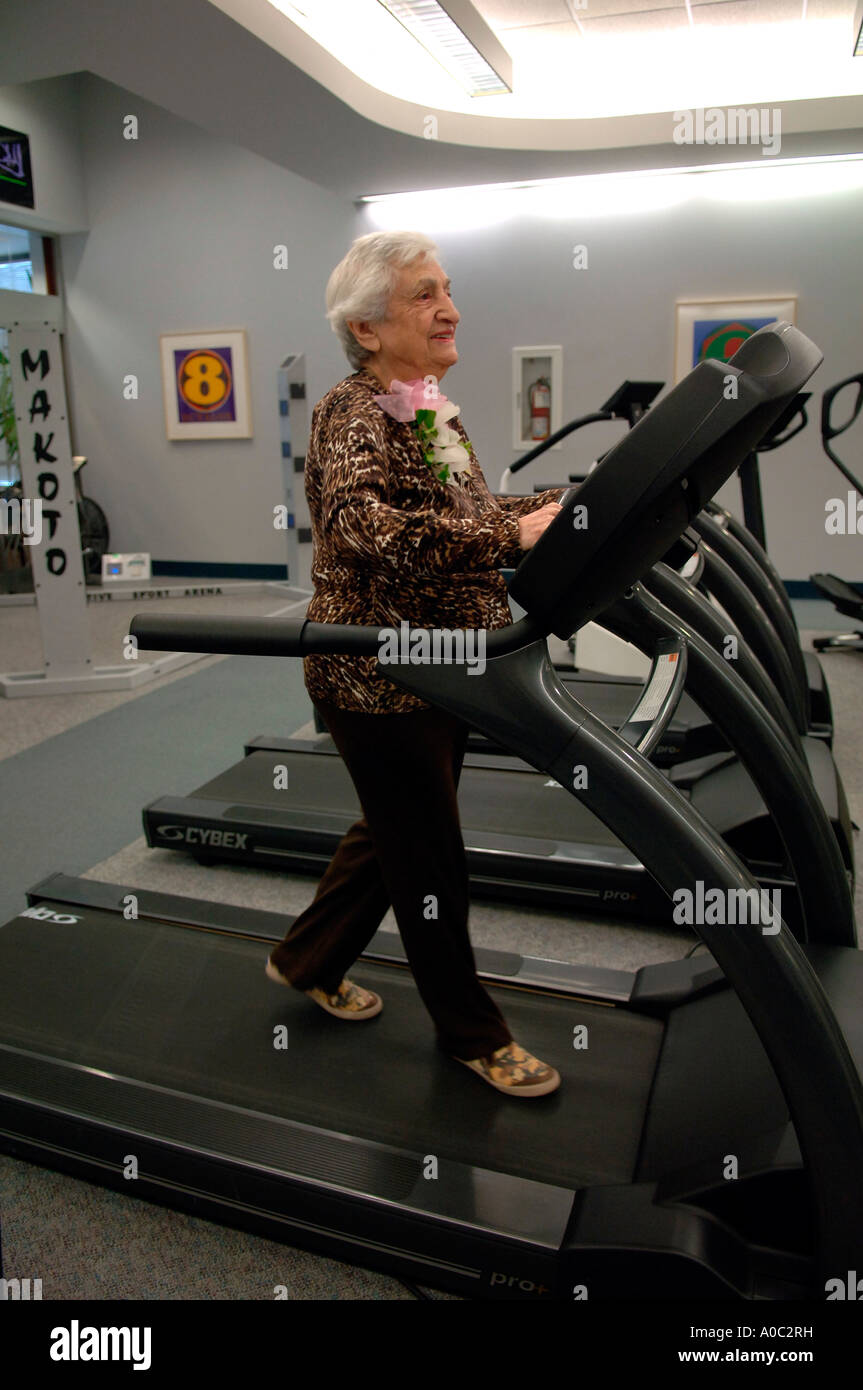 100 year old woman demonstrates her use of treadmill Stock Photo - Alamy