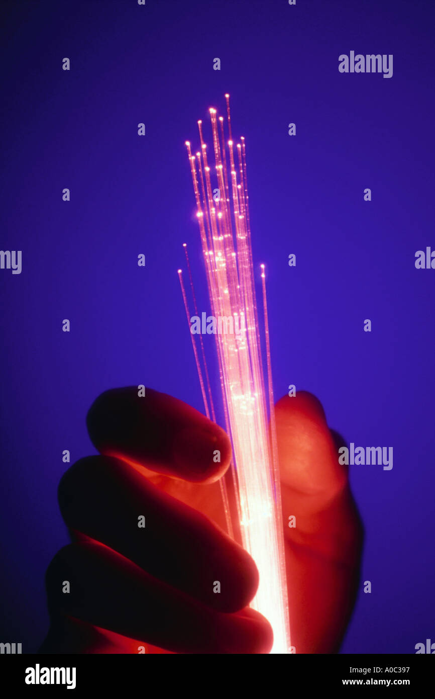 Hand holding fiber optic strands Stock Photo - Alamy