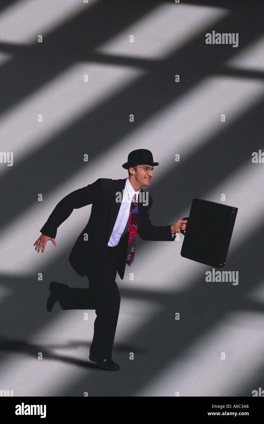Businessman running briefcase abstract hi-res stock photography and ...