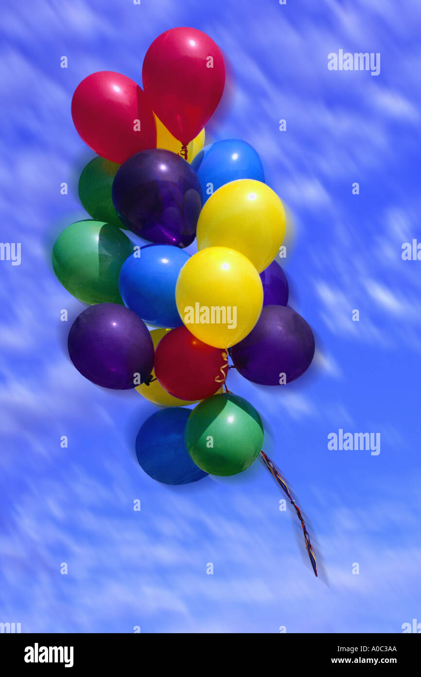 Group of multi-colored balloons flying in sky Stock Photo - Alamy