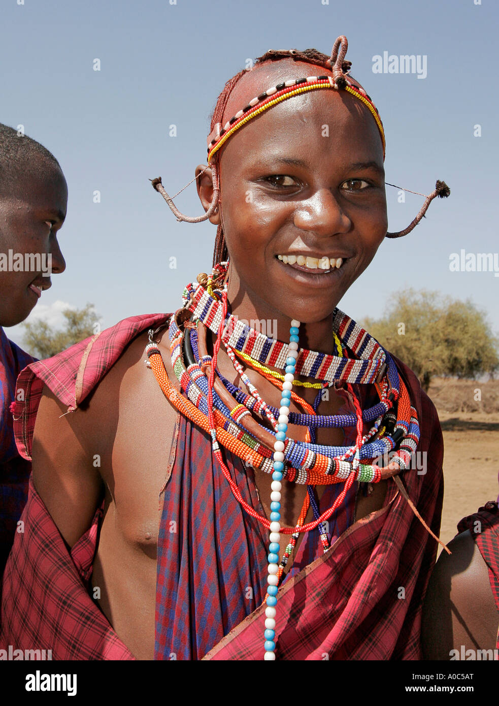 Smiling young Maasai warrior Stock Photo - Alamy