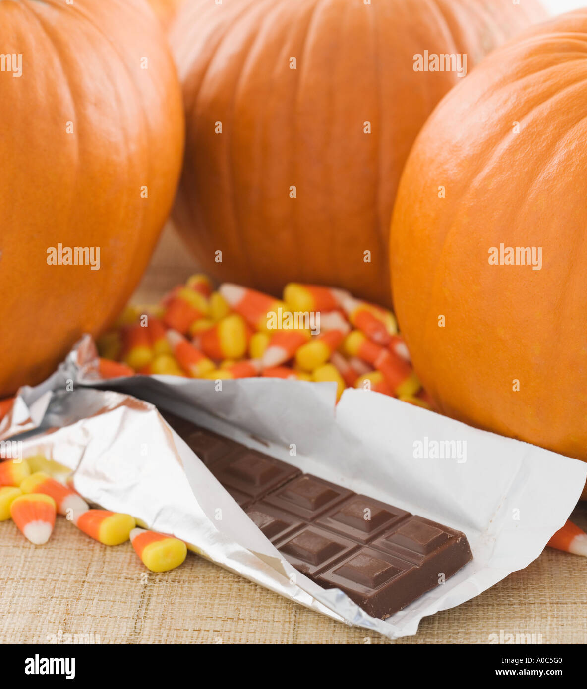 Still life of pumpkins and candy Stock Photo - Alamy