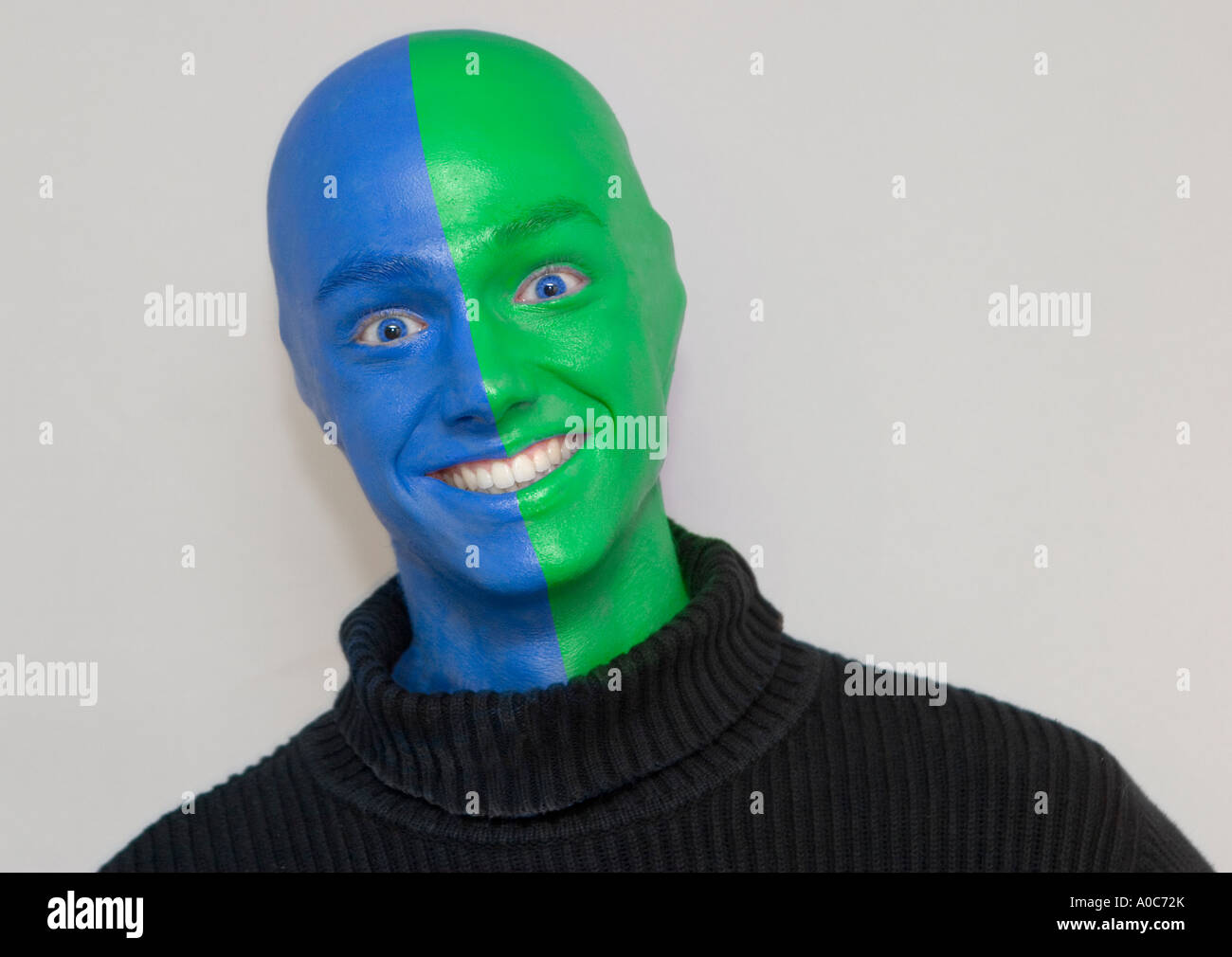 Smiling Blue and Green Painted Man Stock Photo - Alamy