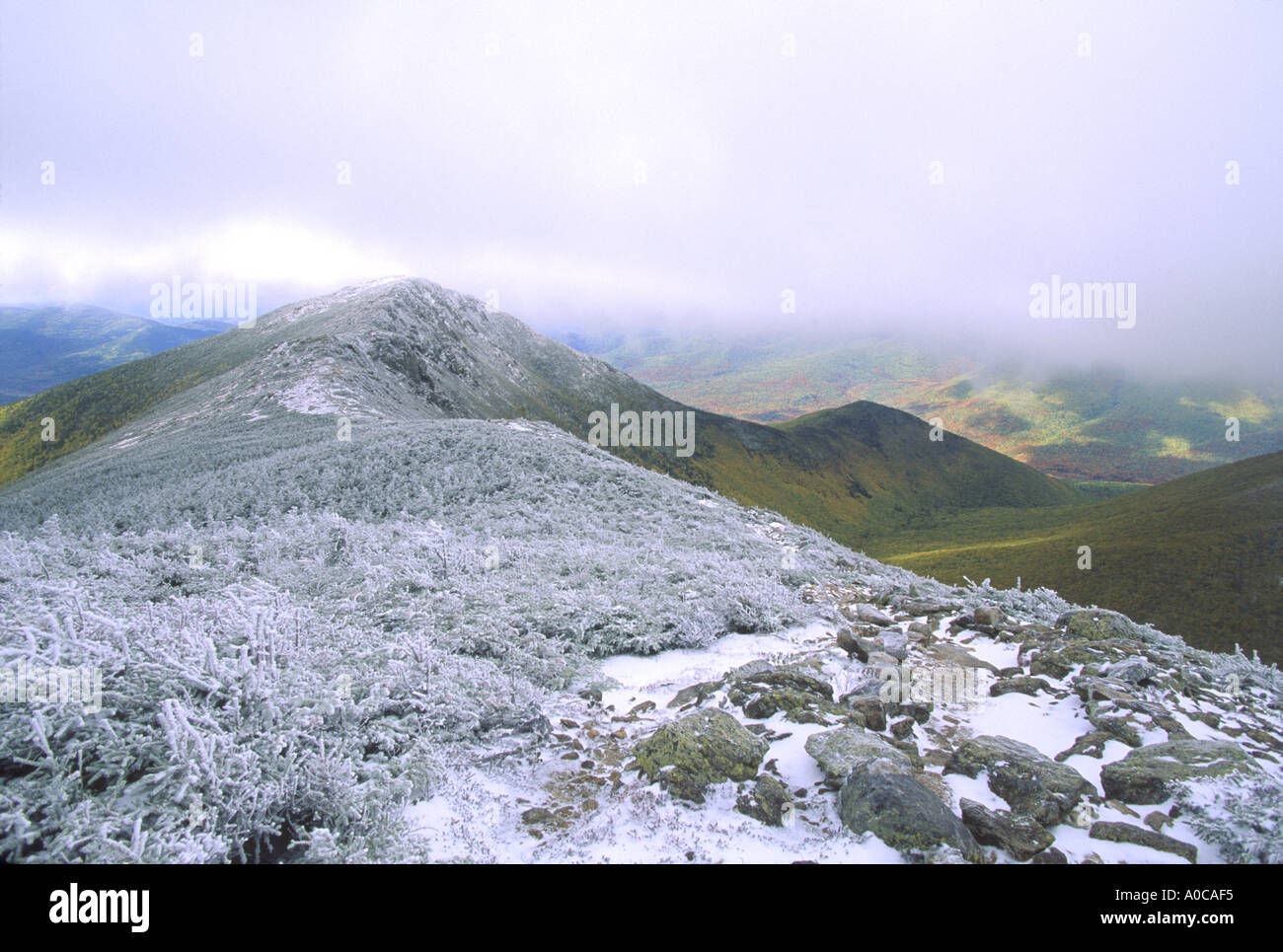 Snow covered ridge in fall Stock Photo - Alamy