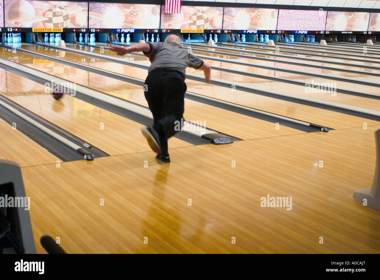 Older man bowling Stock Photo - Alamy