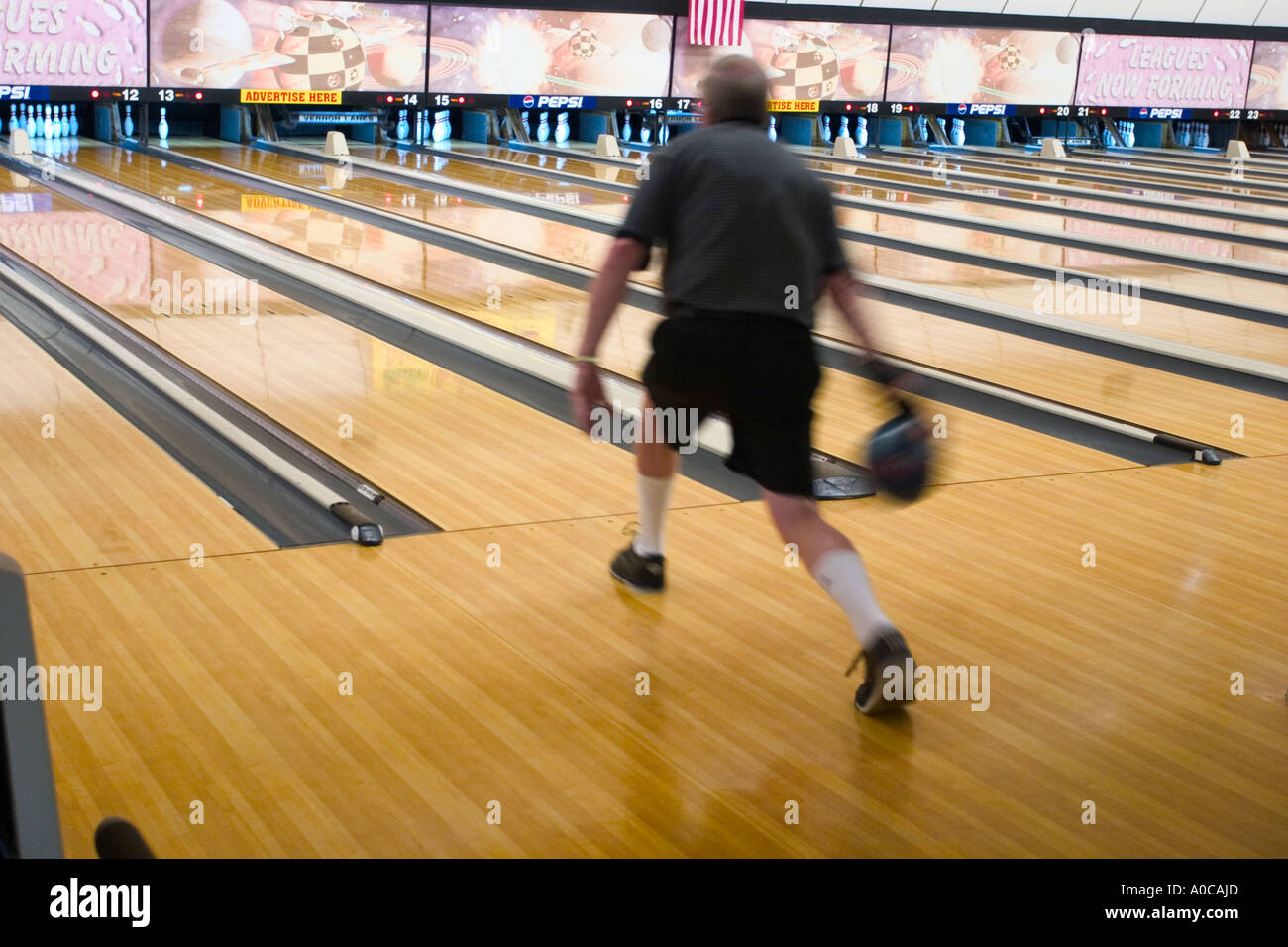 Older man bowling Stock Photo - Alamy