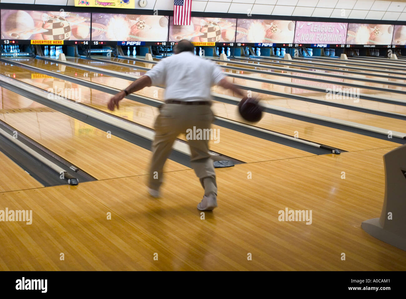 Older man bowling Stock Photo - Alamy