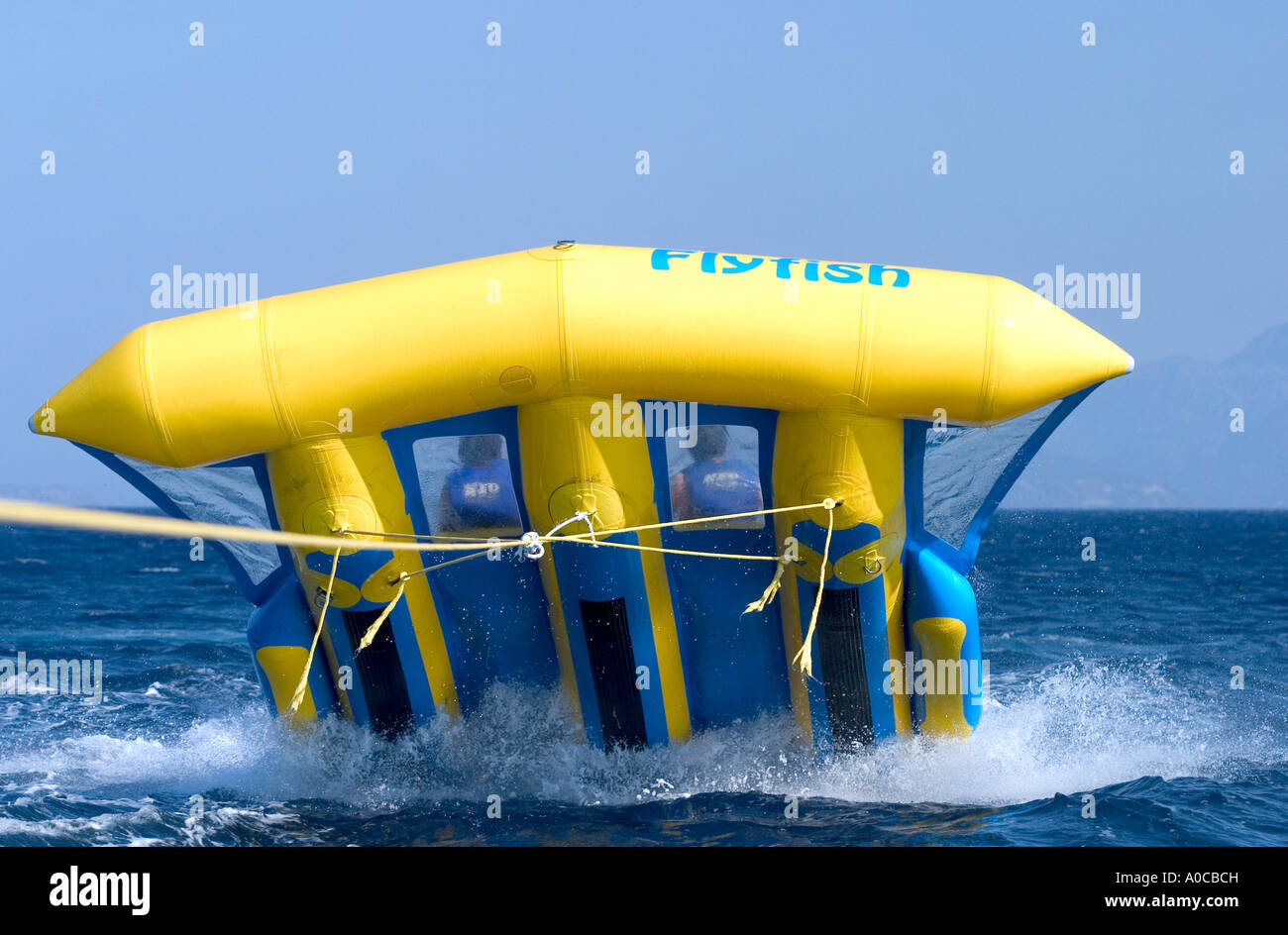 fun in riding an inflatable boat pulled by an outboard motor Stock ...