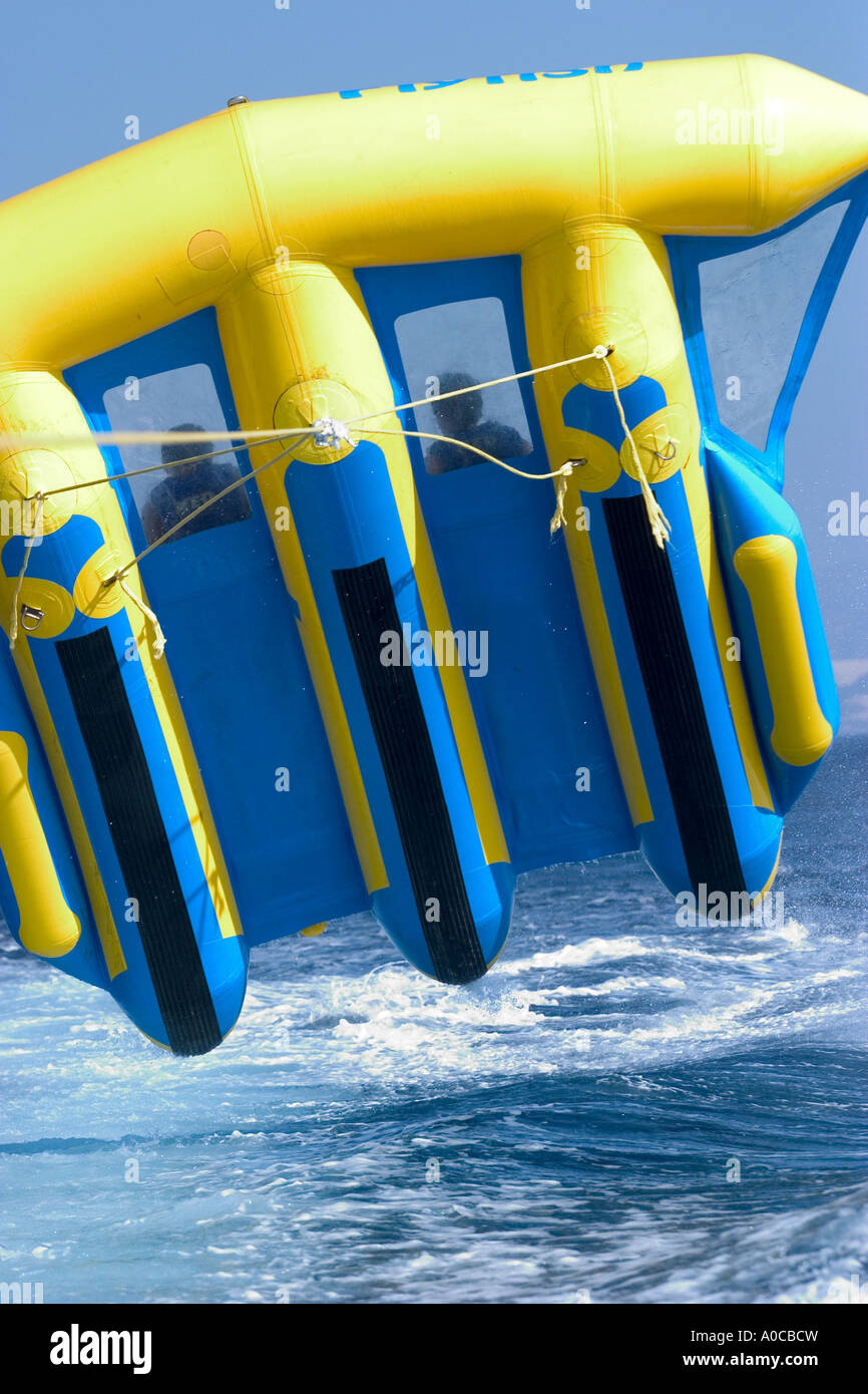 fun in riding an inflatable boat pulled by an outboard motor Stock ...