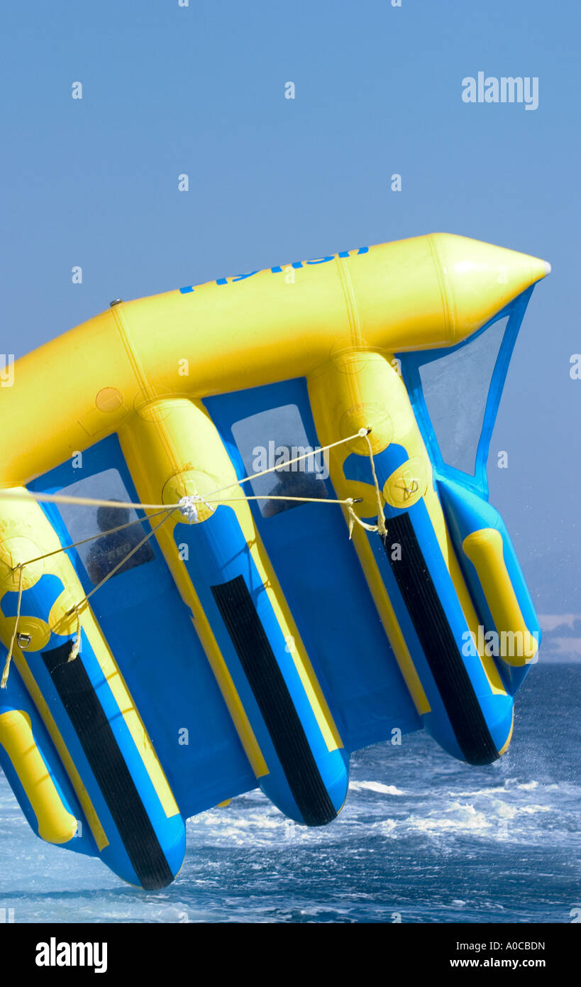 fun in riding an inflatable boat pulled by an outboard motor Stock ...