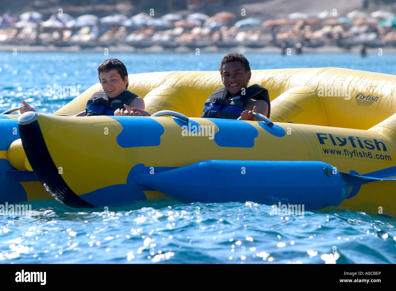 fun in riding an inflatable boat pulled by an outboard motor Stock ...