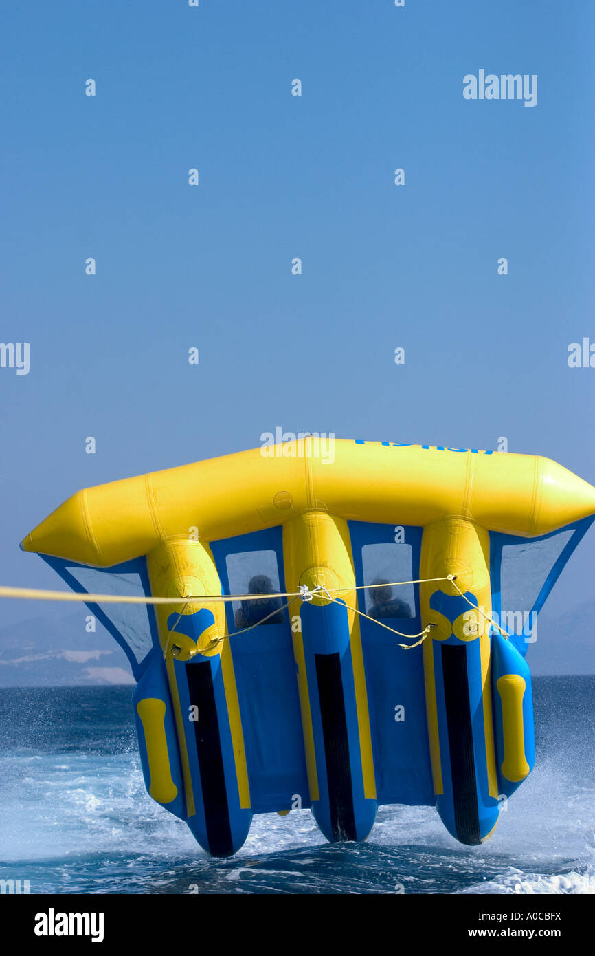 fun in riding an inflatable boat pulled by an outboard motor Stock ...