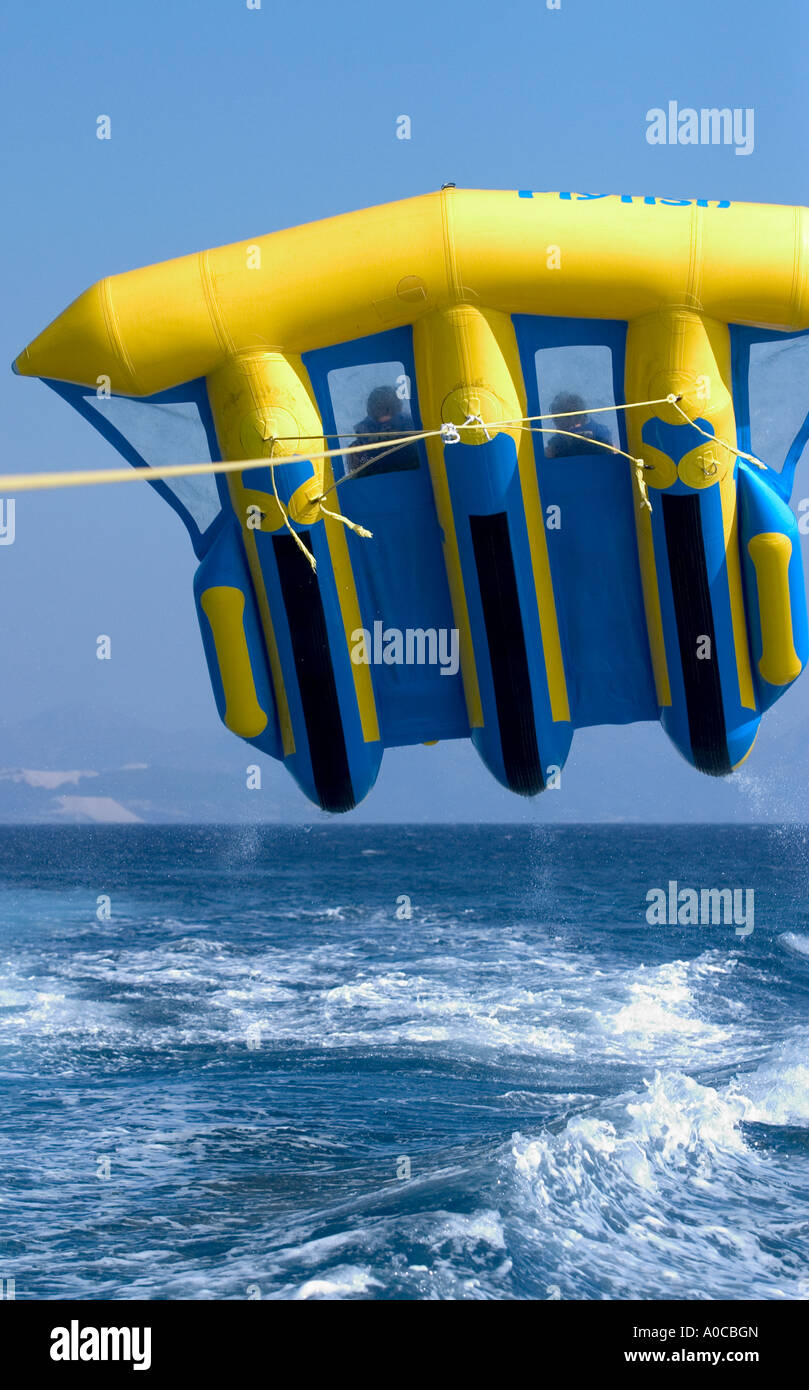 fun in riding an inflatable boat pulled by an outboard motor Stock ...